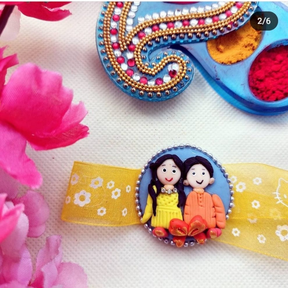 Beautiful Handpainted Clay Rakhi For Your Brother And Bhabhi